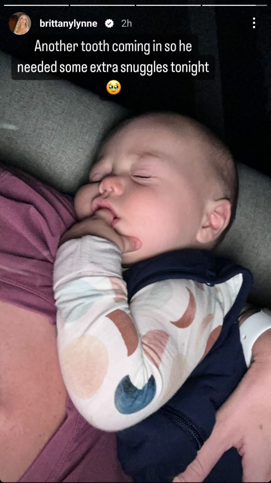 Sterling & Bronze play on a swing, he also has a tooth coming in